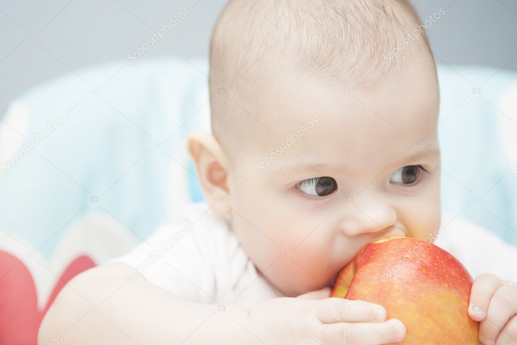 Little caucasian tot eating an apple — Stock Photo © dimamorgan12 #26771989