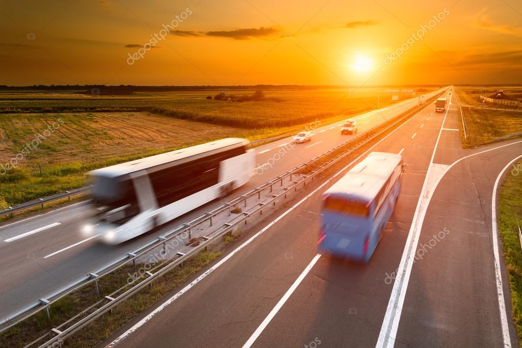 Two buses on highway in motion blur — Stock Photo © rasica #51408571