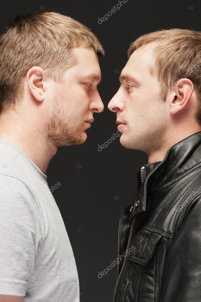 Two guys looking intensely into each others eyes Stock Photo by ...
