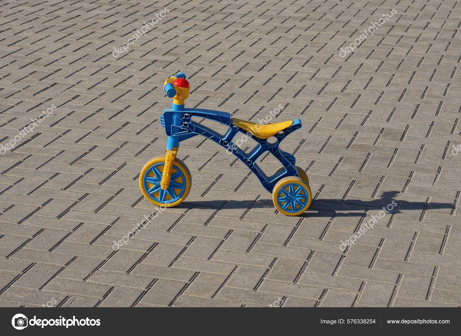One Small Plastic Tricycle Stands Gray Sidewalk Street Stock Photo by ...
