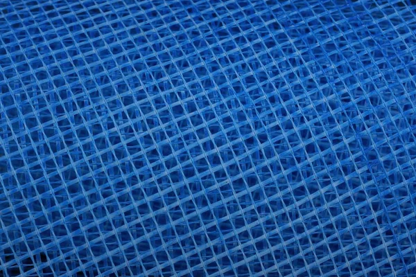 plastic texture of blue mesh in a roll - Stock Image - Everypixel