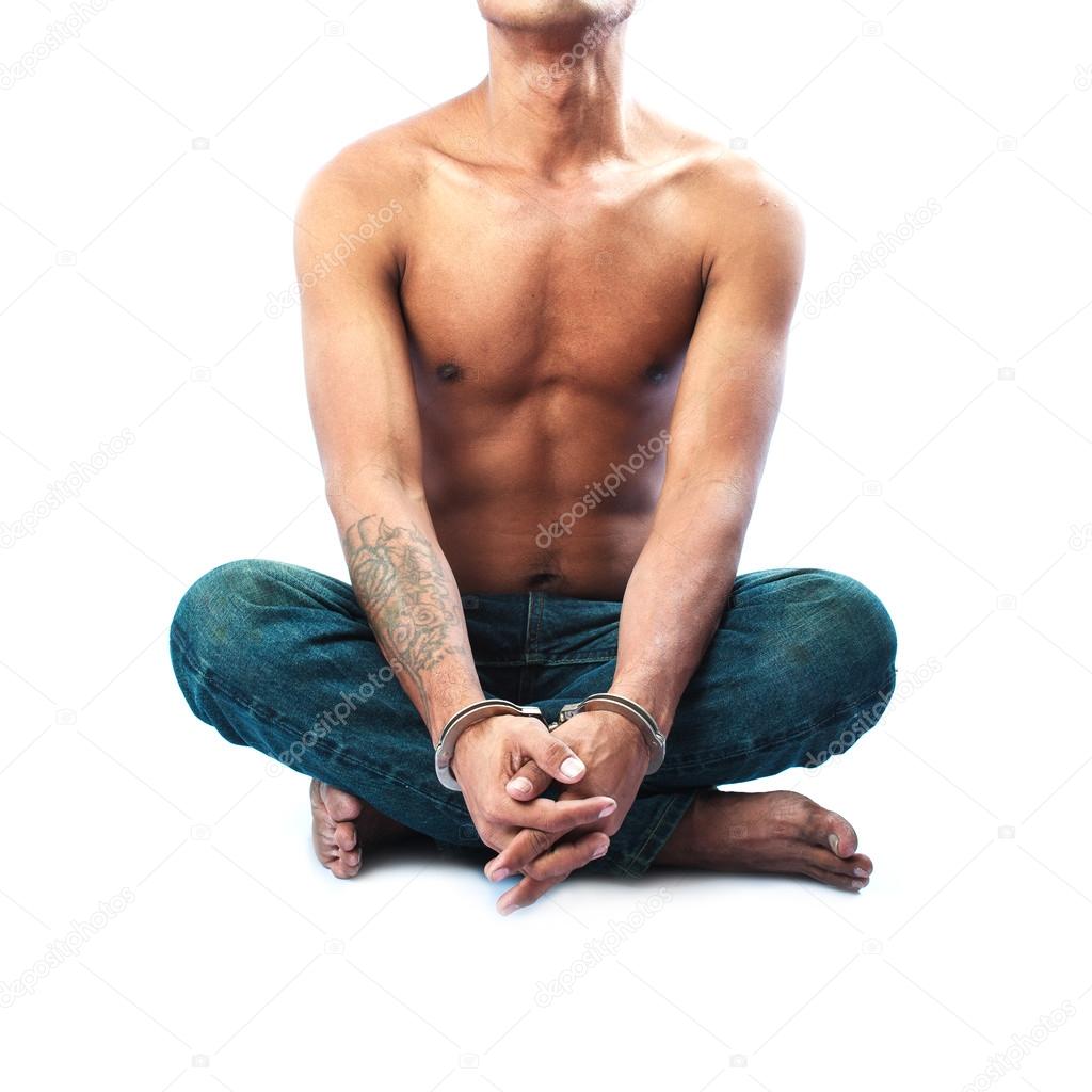 Prisoner locked in handcuffs Stock Photo by ©Naypong 37694005