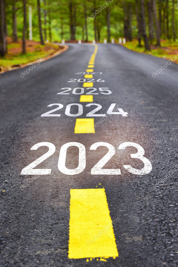 New year of 2023 2024 2025 and 2027 on asphalt road surface with ...
