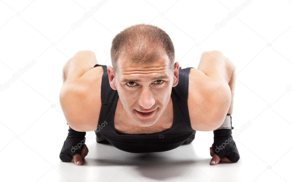 Masculine man doing pushups. Stock Photo by ©Dangubic 26382119