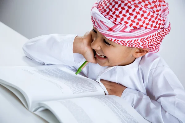 Arabic boy doing homework Stock Photos, Royalty Free Arabic boy doing ...