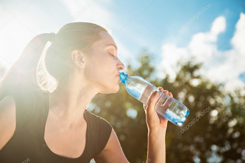 Woman Dinking Water — Stock Photo © Dangubic #50499413