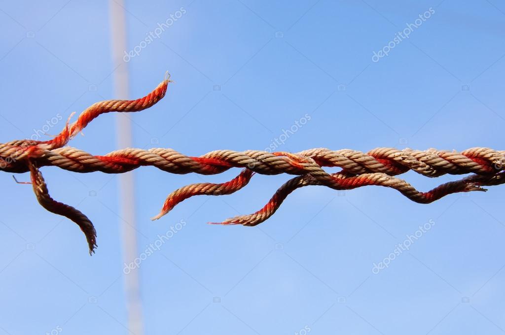 Broken rope on blue sky background. — Stock Photo © artitcom #33323457