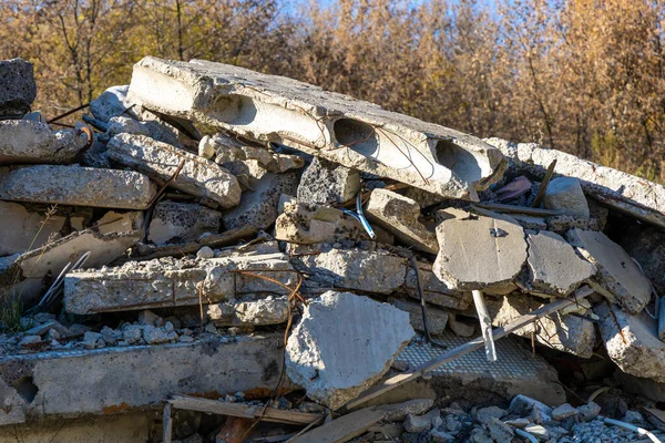 Fragments of a destroyed concrete building. The wreckage of a ...