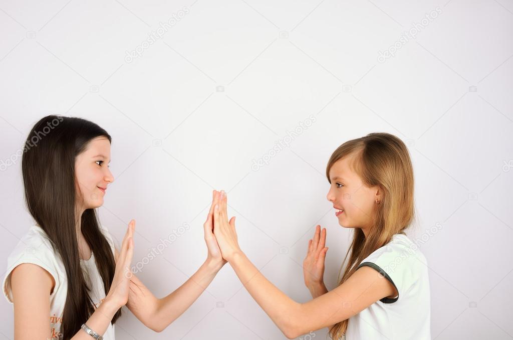 Two girls claping palms — Stock Photo © Tanya.Ru #45201999