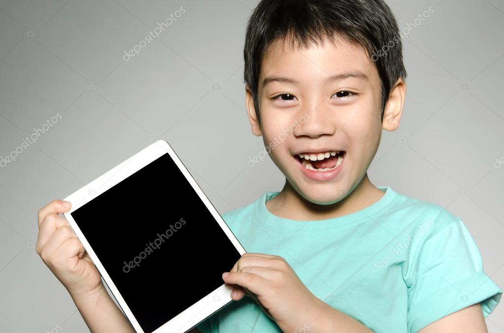 Little asian boy smiles with tablet computer Stock Photo by ©sirikornt ...