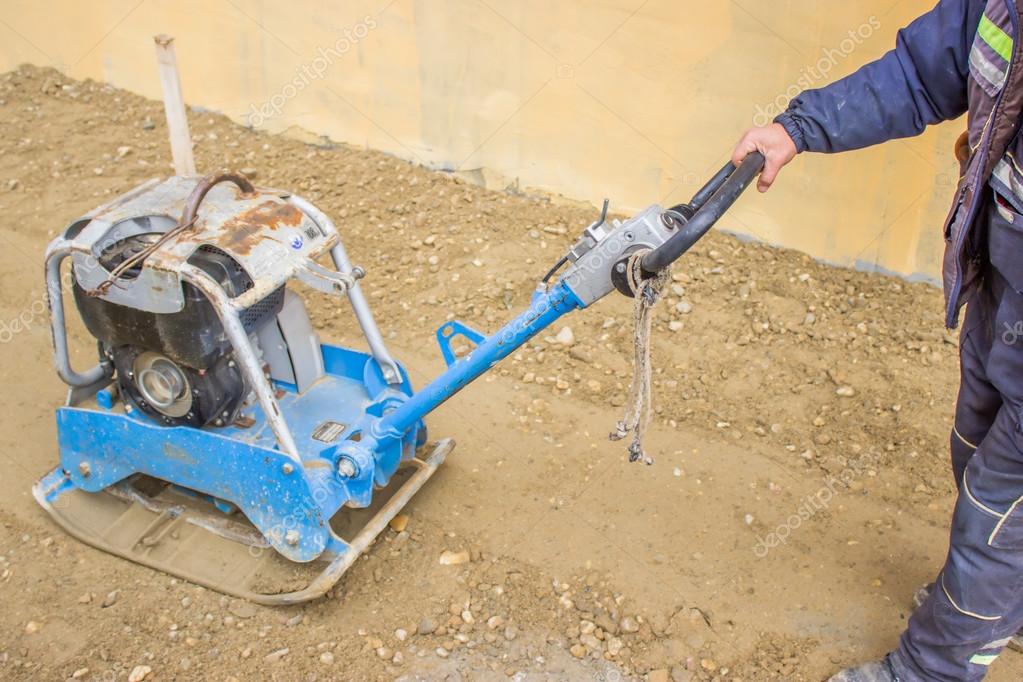 Worker with vibrating plate compactor machine 4 — Stock Photo ...