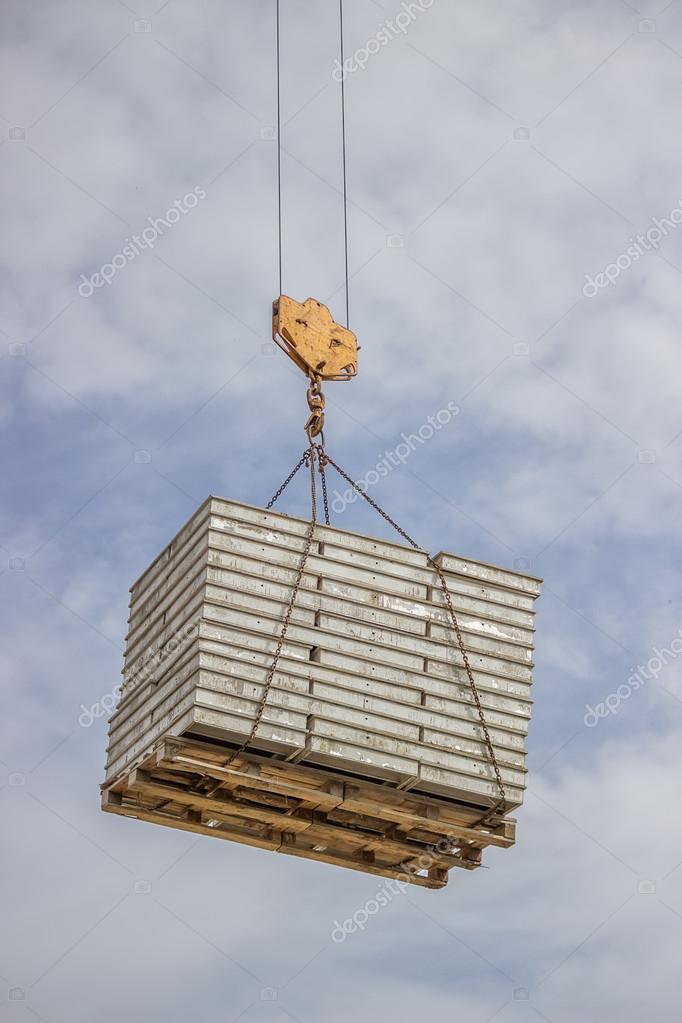 Lifting pallet with formwork elements by crane 2 — Stock Photo ...