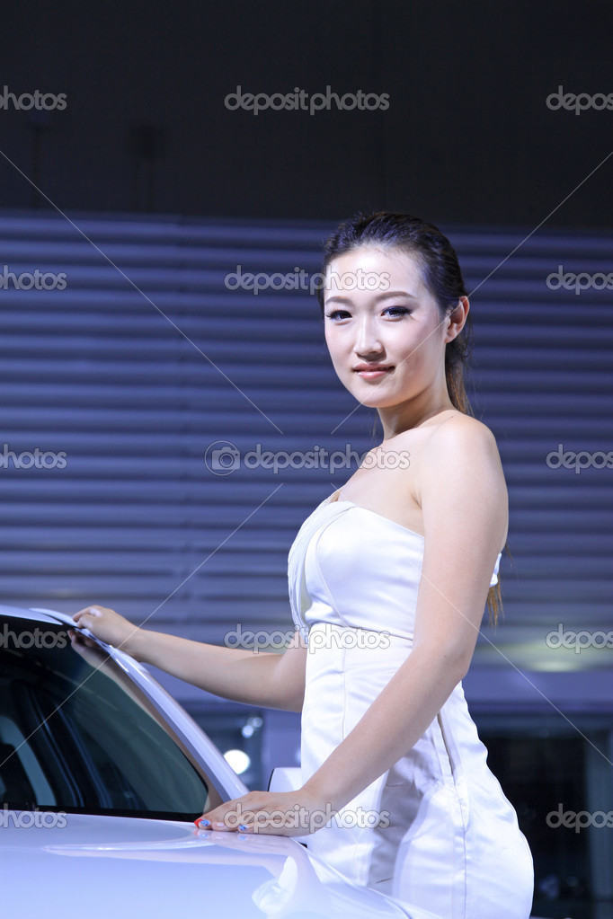 Beautiful female model in a car exhibition, China — Stock Editorial ...