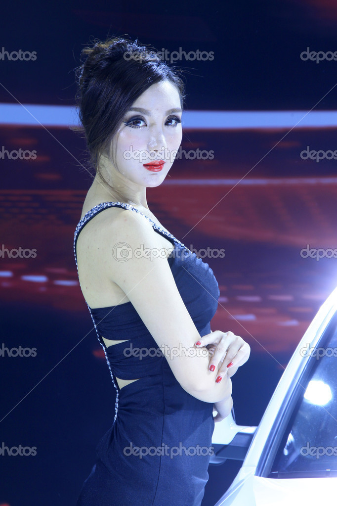 Beautiful female model in a car exhibition, China — Stock Editorial ...