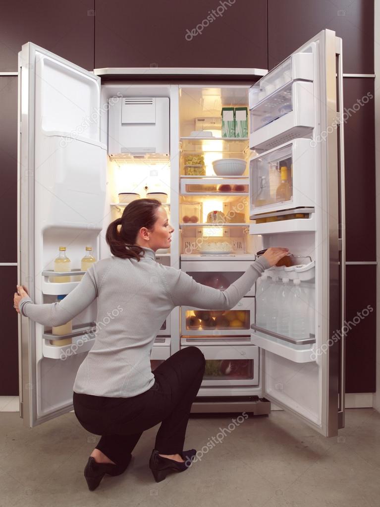 Woman looking for something to eat — Stock Photo © toocan #42625217