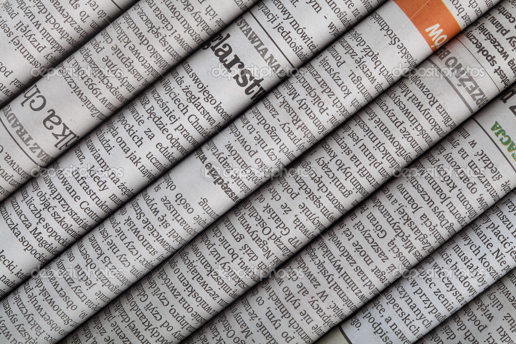 Newspaper headlines shown side on in a stack of daily newspapers Stock ...