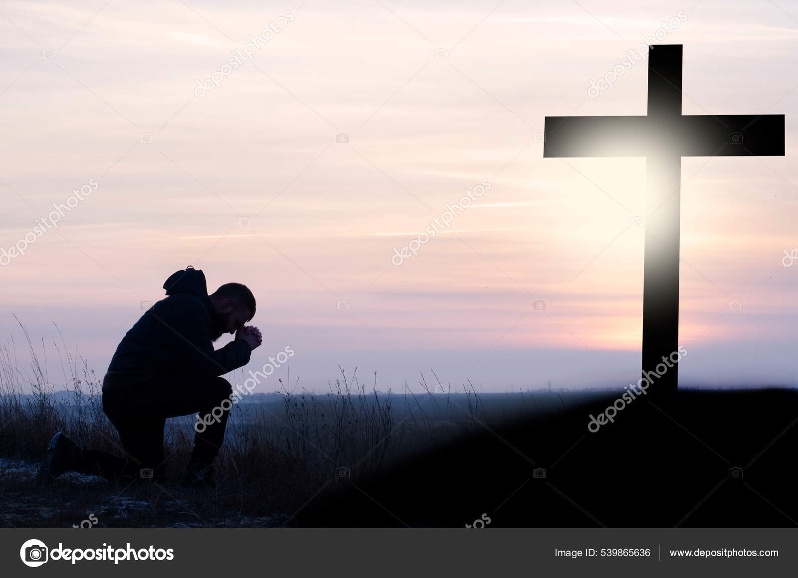 Kneeling In Prayer At The Cross