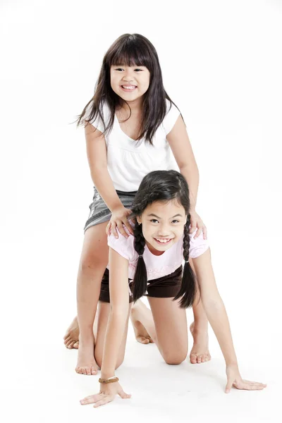 Little girls playing Stock Photo by ©AppleEyesStudio 29253421