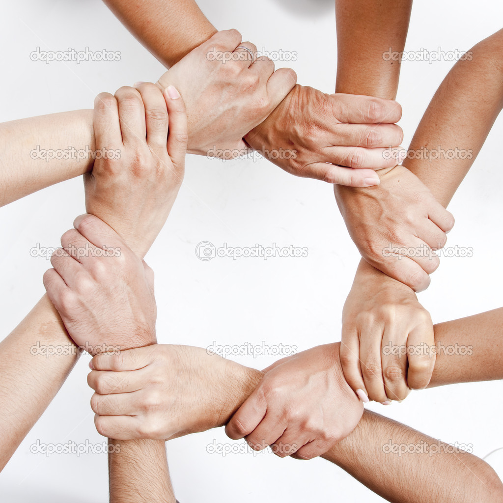 Small group of business people joining hands — Stock Photo ...