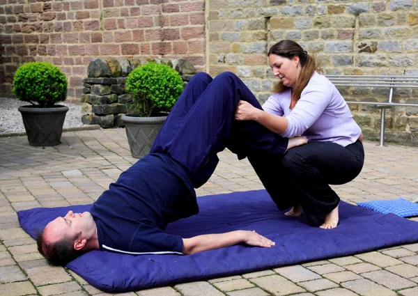 Assisted shoulder stand - Stock Image - Everypixel