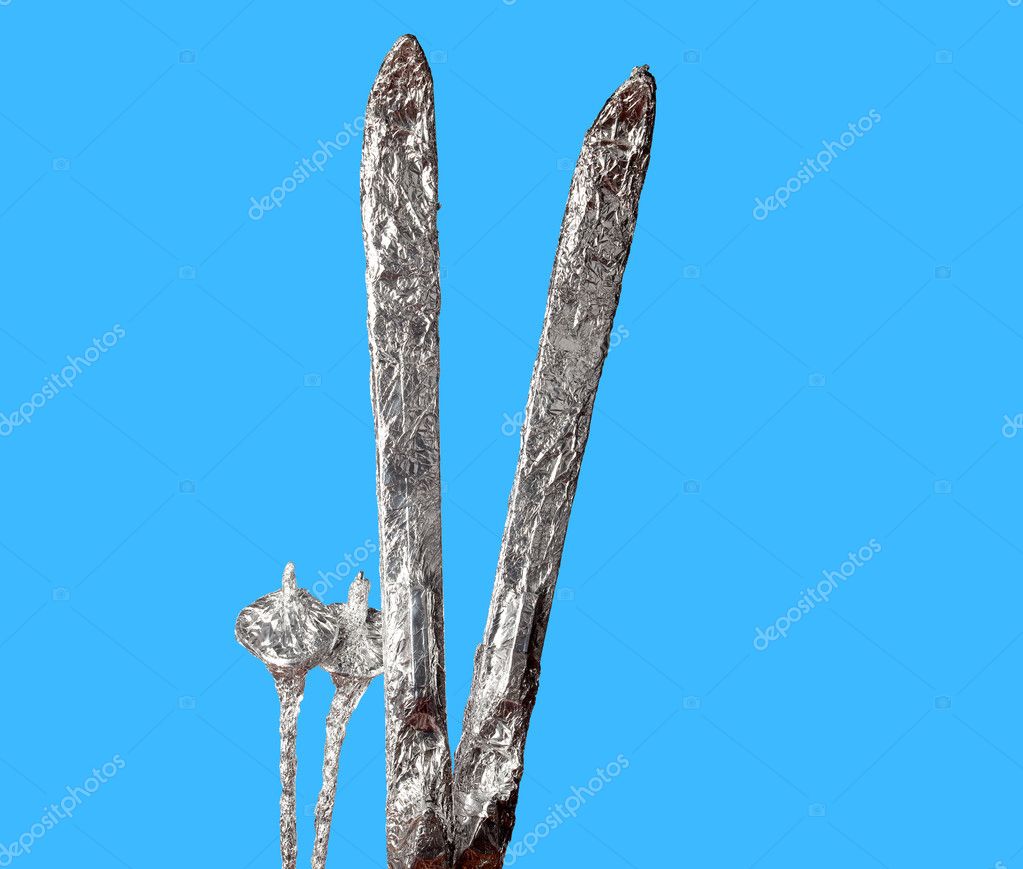 Wrapped skis and sticks isolated on blue — Stock Photo © dp3010 #50174291