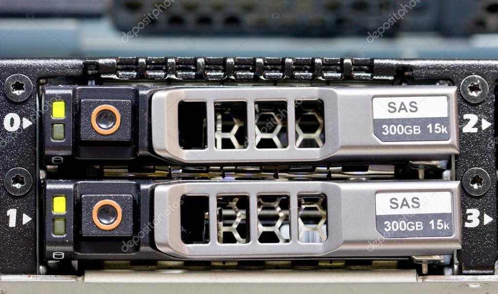 Row of hard drives mounted in a rack in a data center — Stock Photo ...