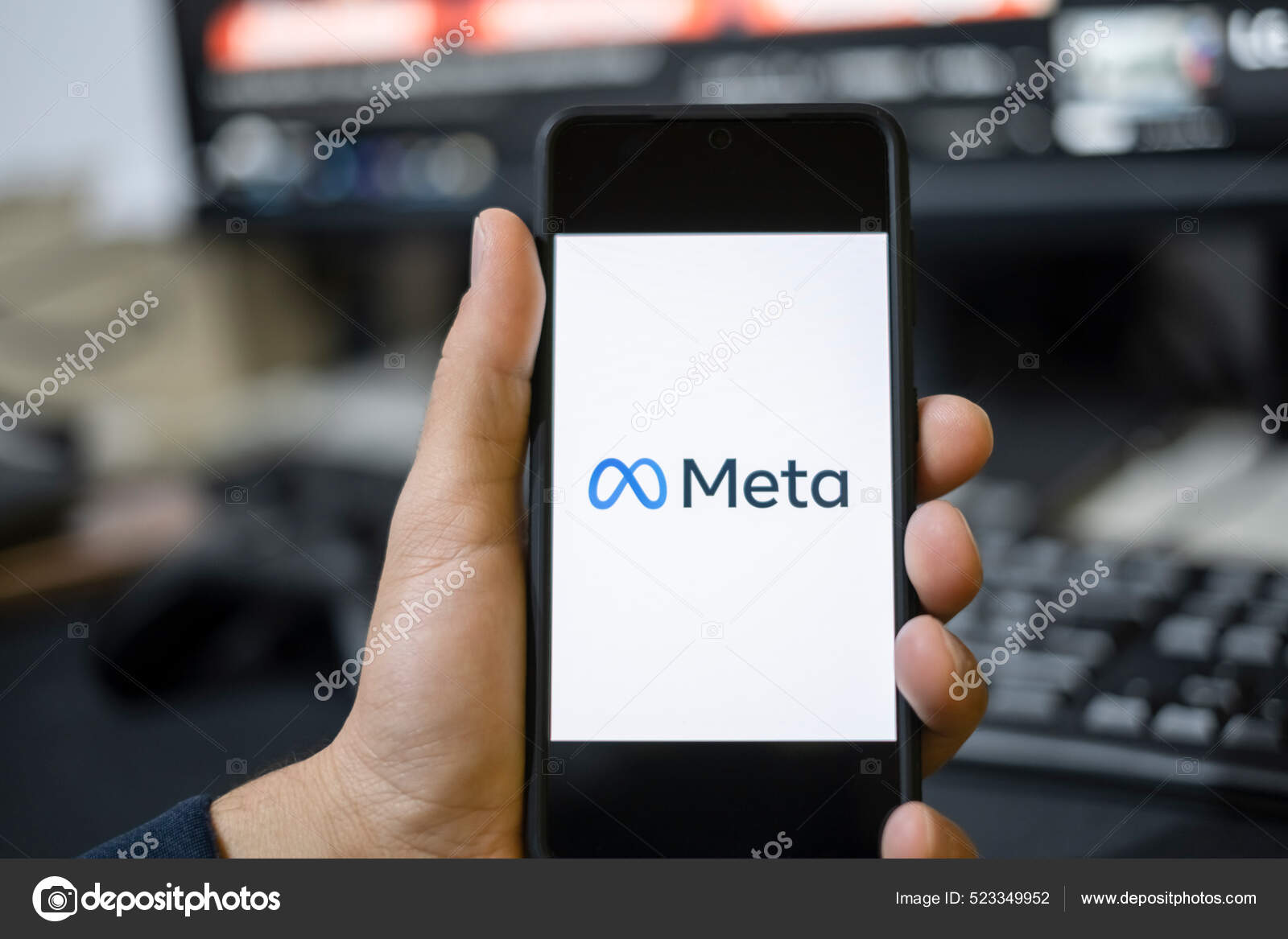 Young man using new Meta app on a smartphone,Facebook rebranding logo ...