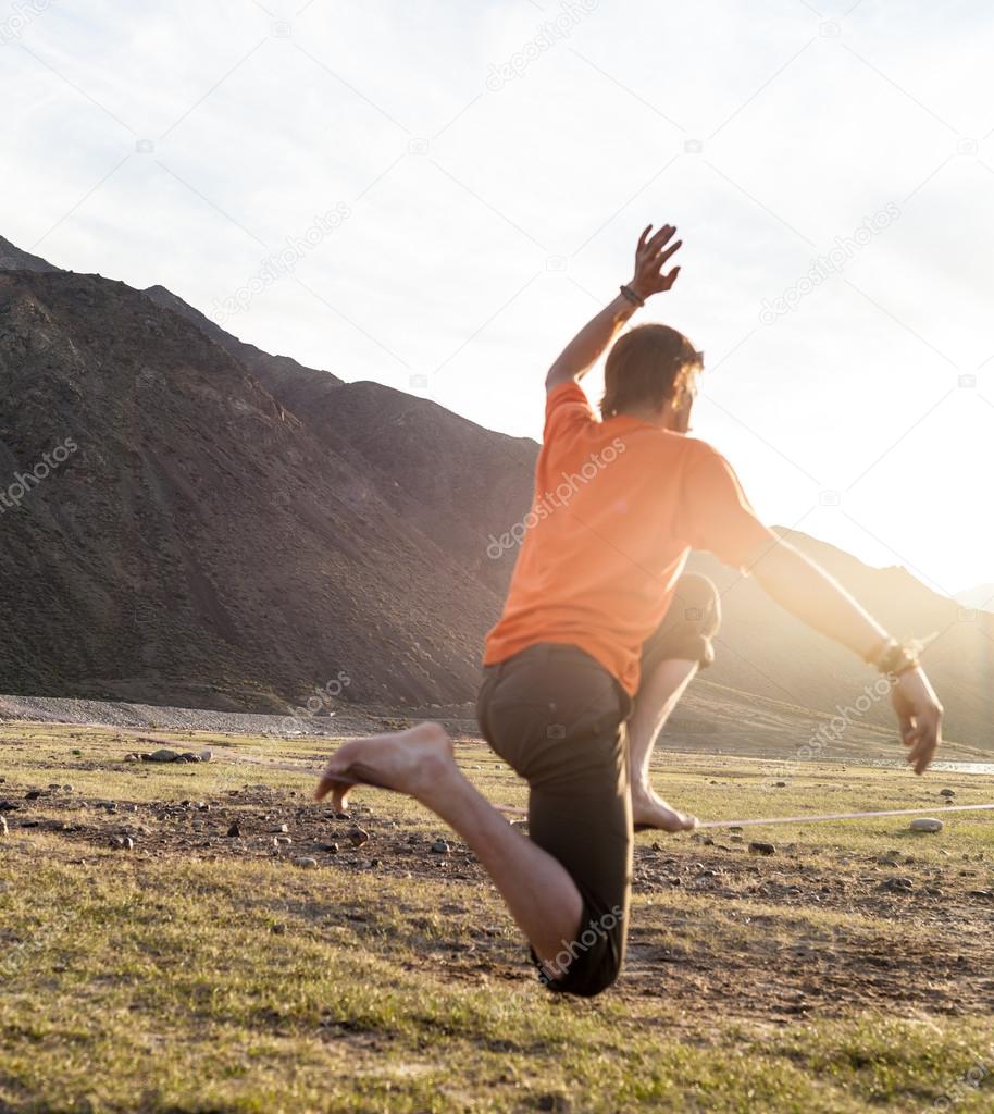 Man walking on the sling at sunset — Stock Photo © Wassiliy #47141241