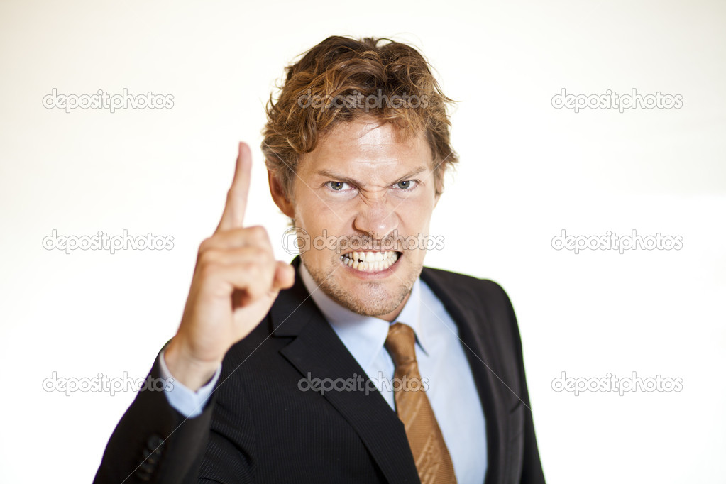 Angry businessman telling someone off — Stock Photo © rugdal #29895003
