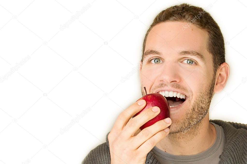Happy man eating apple Stock Photo by ©glayan 43550465