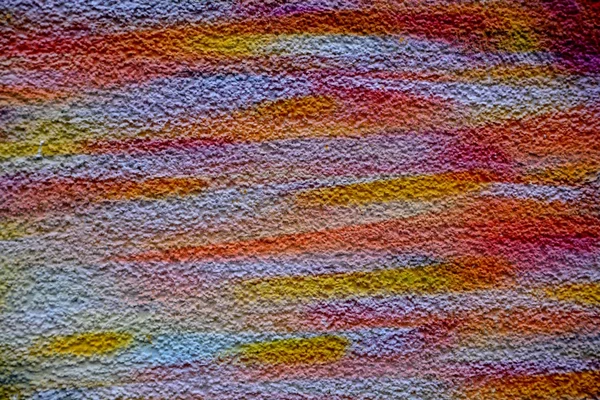 Colorfully painted stone wall - Stock Image - Everypixel