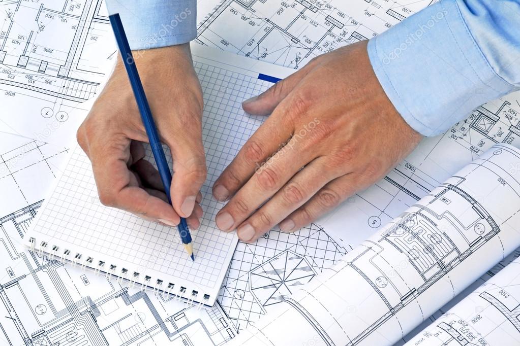 Hands with tool and project drawings Stock Photo by ©GeorgiMironov 51649851