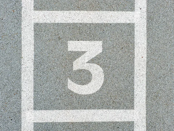 Number three painted on soft rubber surface. Jumping hopscotch game ...