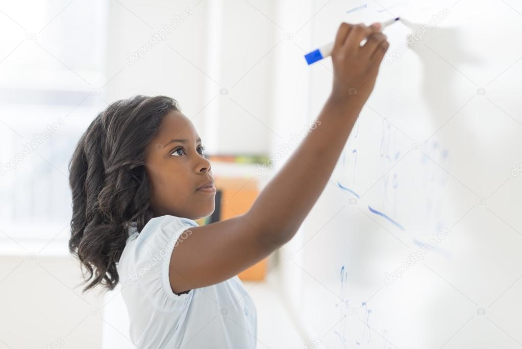 Girl Solving Math Problem On Whiteboard In Classroom — Stock Photo ...