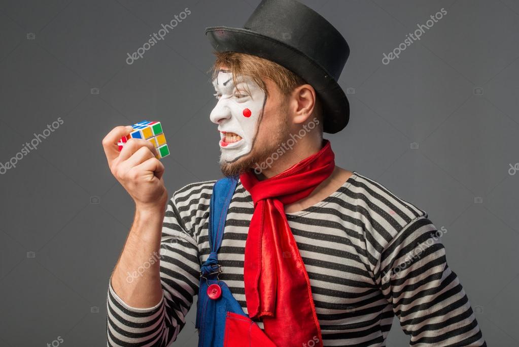 Grimacing clown with Rubik's Cube – Stock Editorial Photo © photollurg2 ...