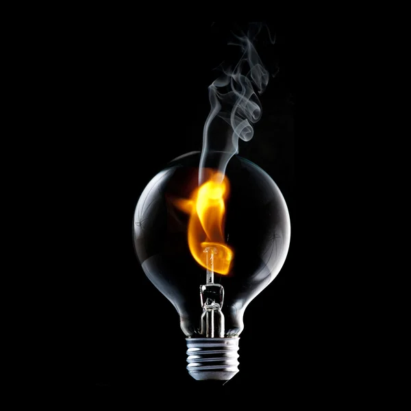 Fire and smoke inside the light bulb — Stock Photo © somchaij #31426061