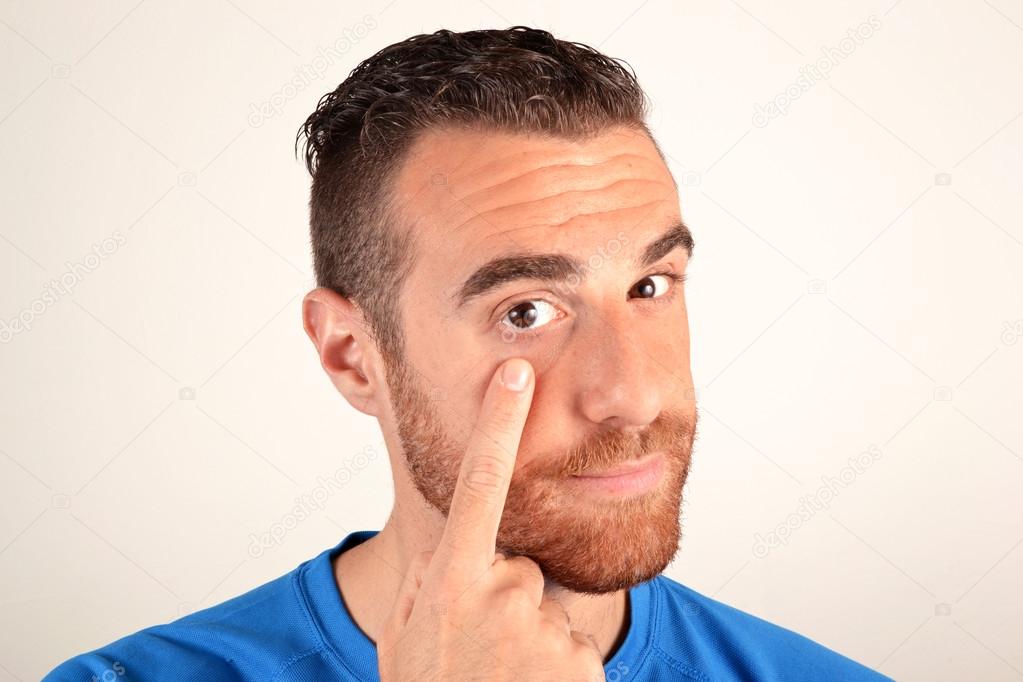 Man pointing his finger eye — Stock Photo © etorres69 #47817347