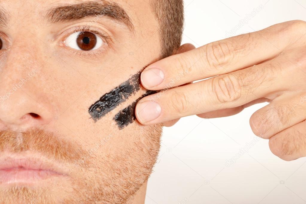 Man with painted face of war — Stock Photo © etorres69 #48877227