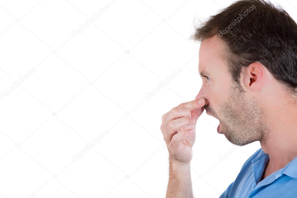 Guy closing nose — Stock Photo © atholpady #30708585