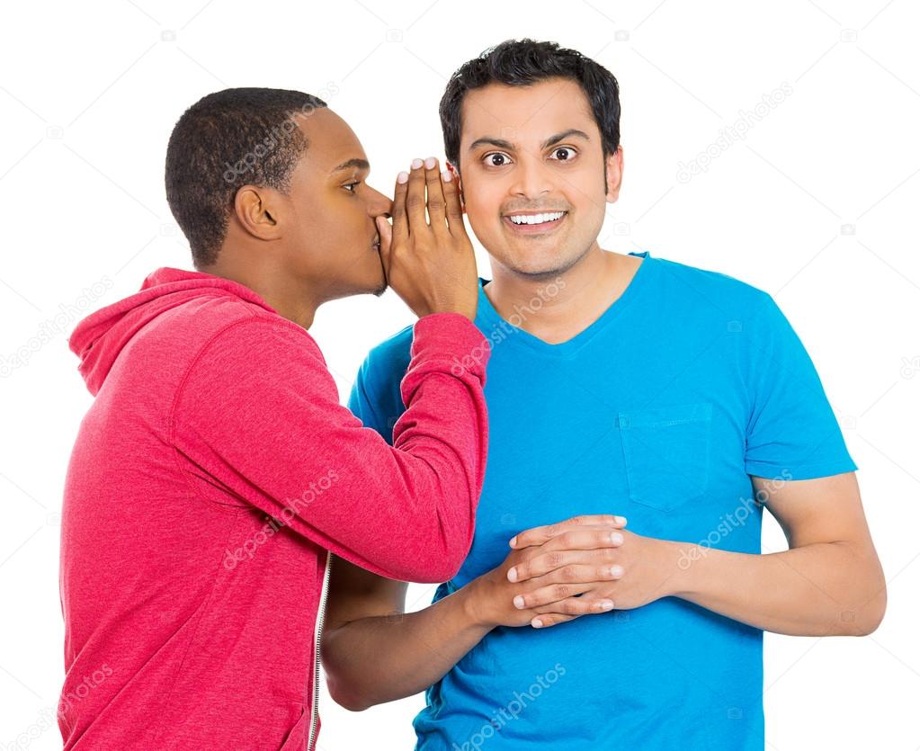Guy whispering into mans ear — Stock Photo © atholpady #37978939