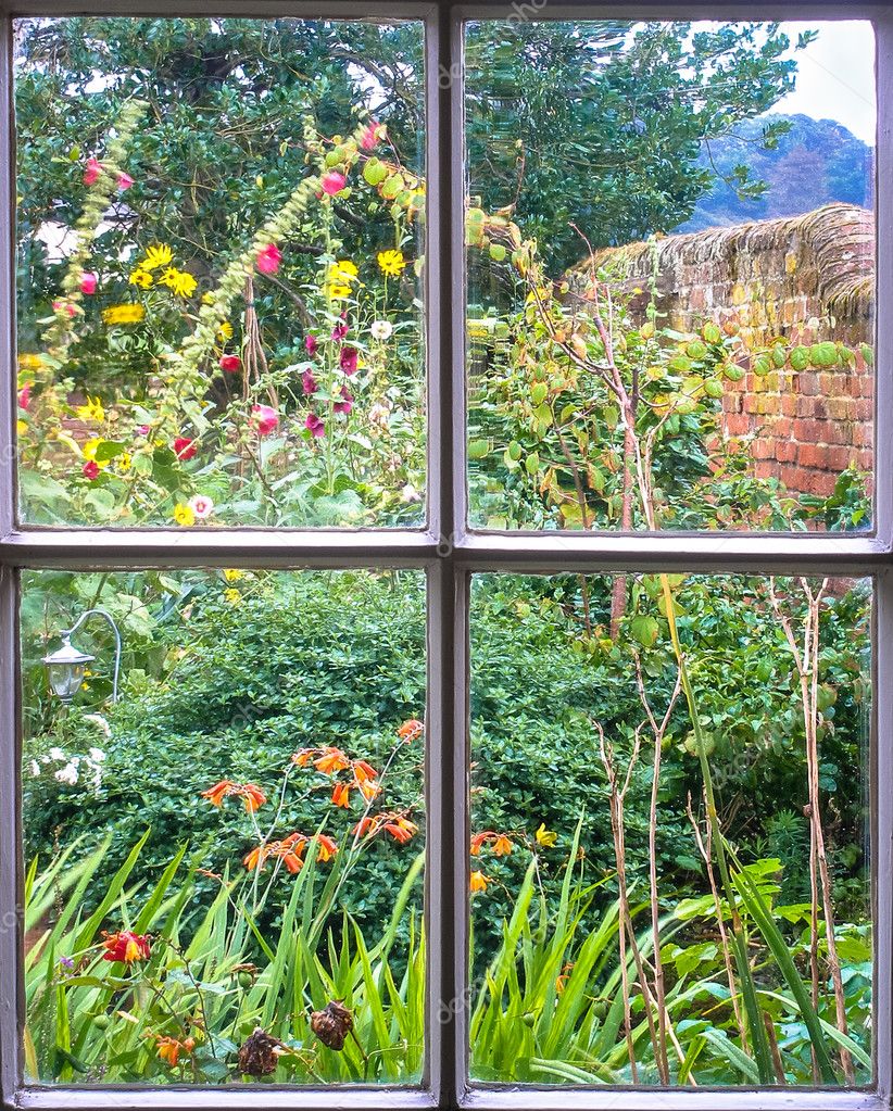Cottage Garden through an old sash window — Stock Photo © scorton #33307695