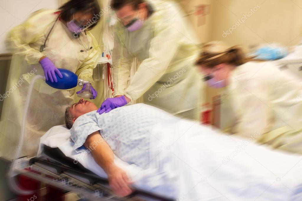 Code blue team resuscitating a patient Stock Photo by ©spackadet2 38176819