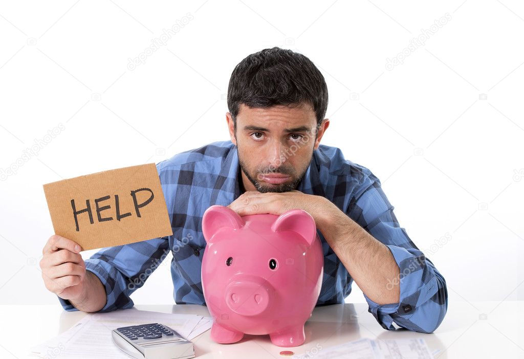 Sad worried man in stress with piggy bank in bad financial situation ...