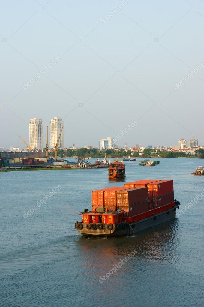 Maritime transport by loading container on river — Stock Photo ...