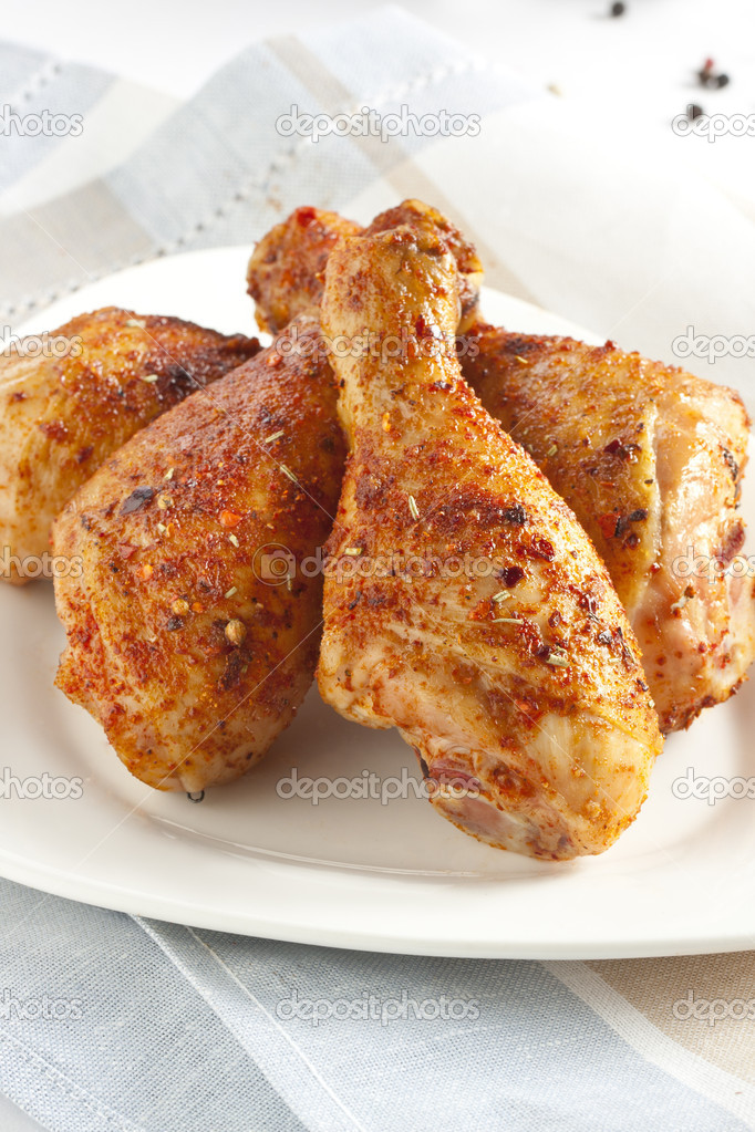Roasted chicken on a plate — Stock Photo © Maya_Mo #30679669