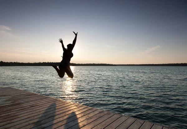 Woman on pier - Stock Image - Everypixel