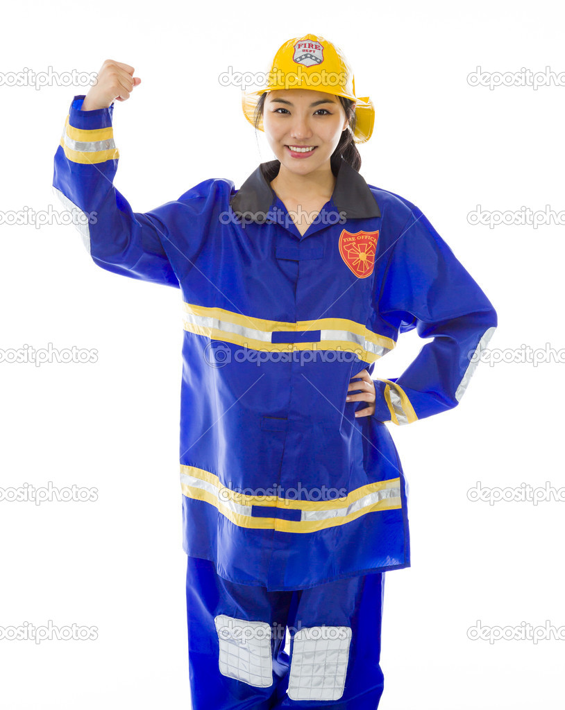 Firefighter showing flexing biceps — Stock Photo © Bruno135 #47648253