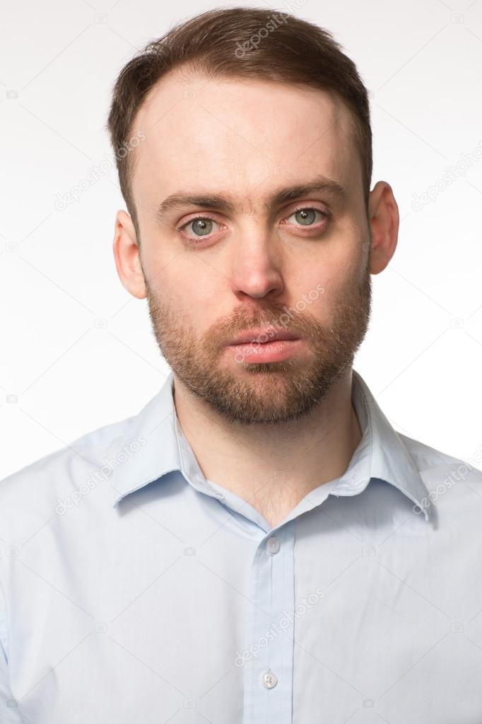 Portrait of a young man with a serious expression — Stock Photo ...