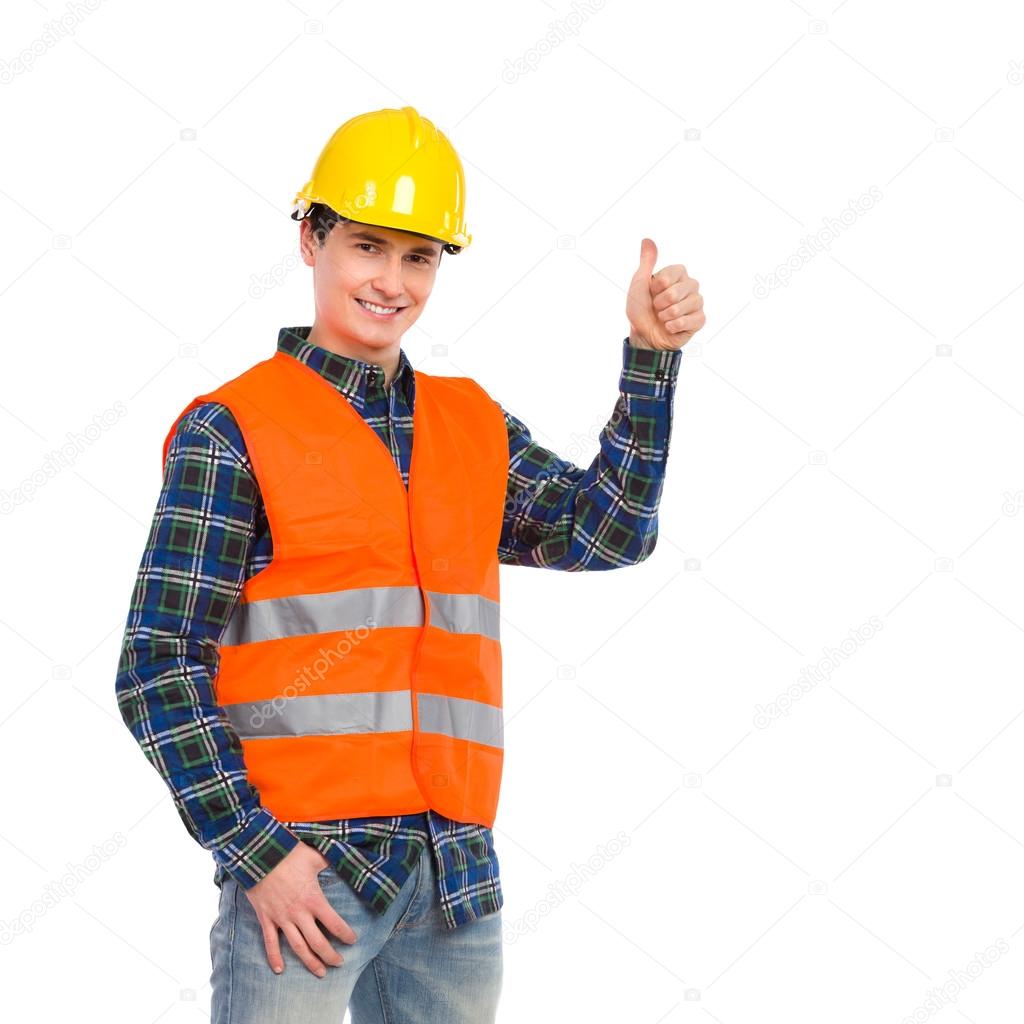 Construction worker wearing reflective clothing and showing thumb up ...