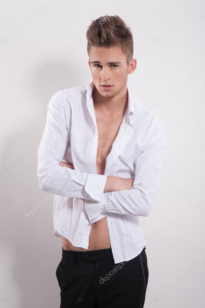 Young guy with crossed hands looing at camera Stock Photo by ©Shineman ...
